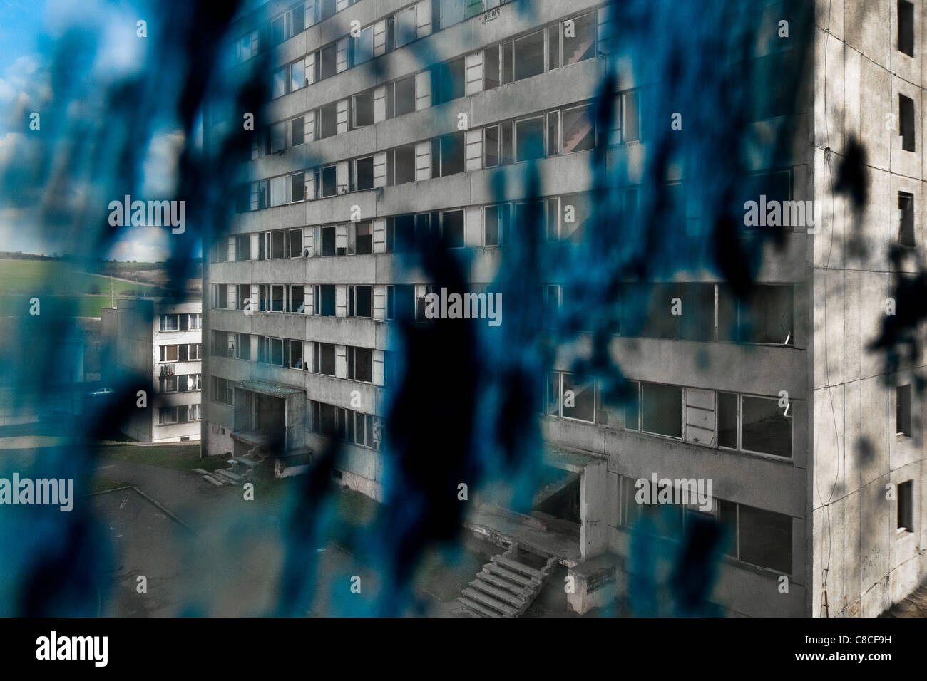 The Gipsy ghetto of Chanov seen through a dirty window in a devastated ...