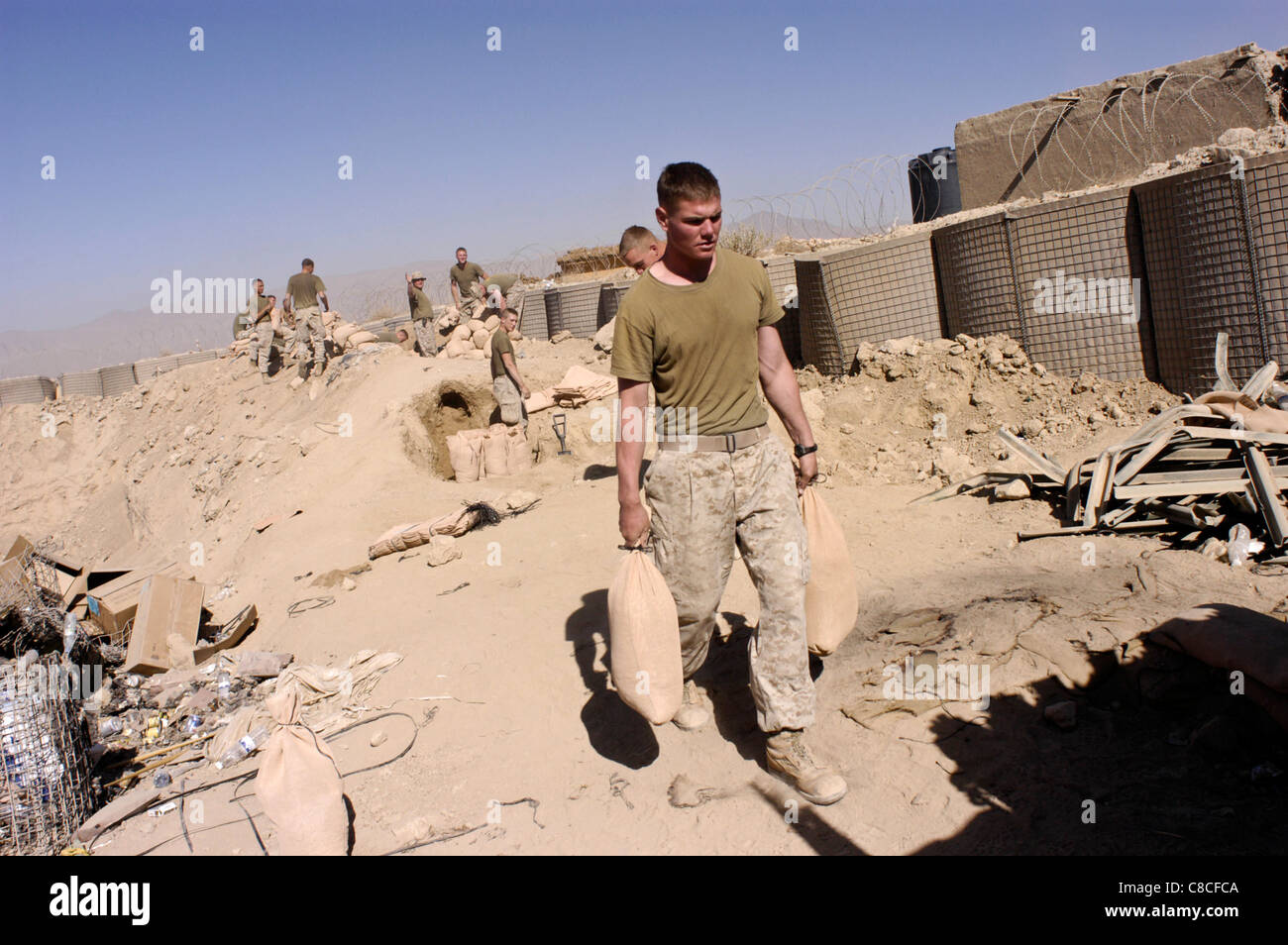 Members of the U.S. military make improvements to the defences at the ...