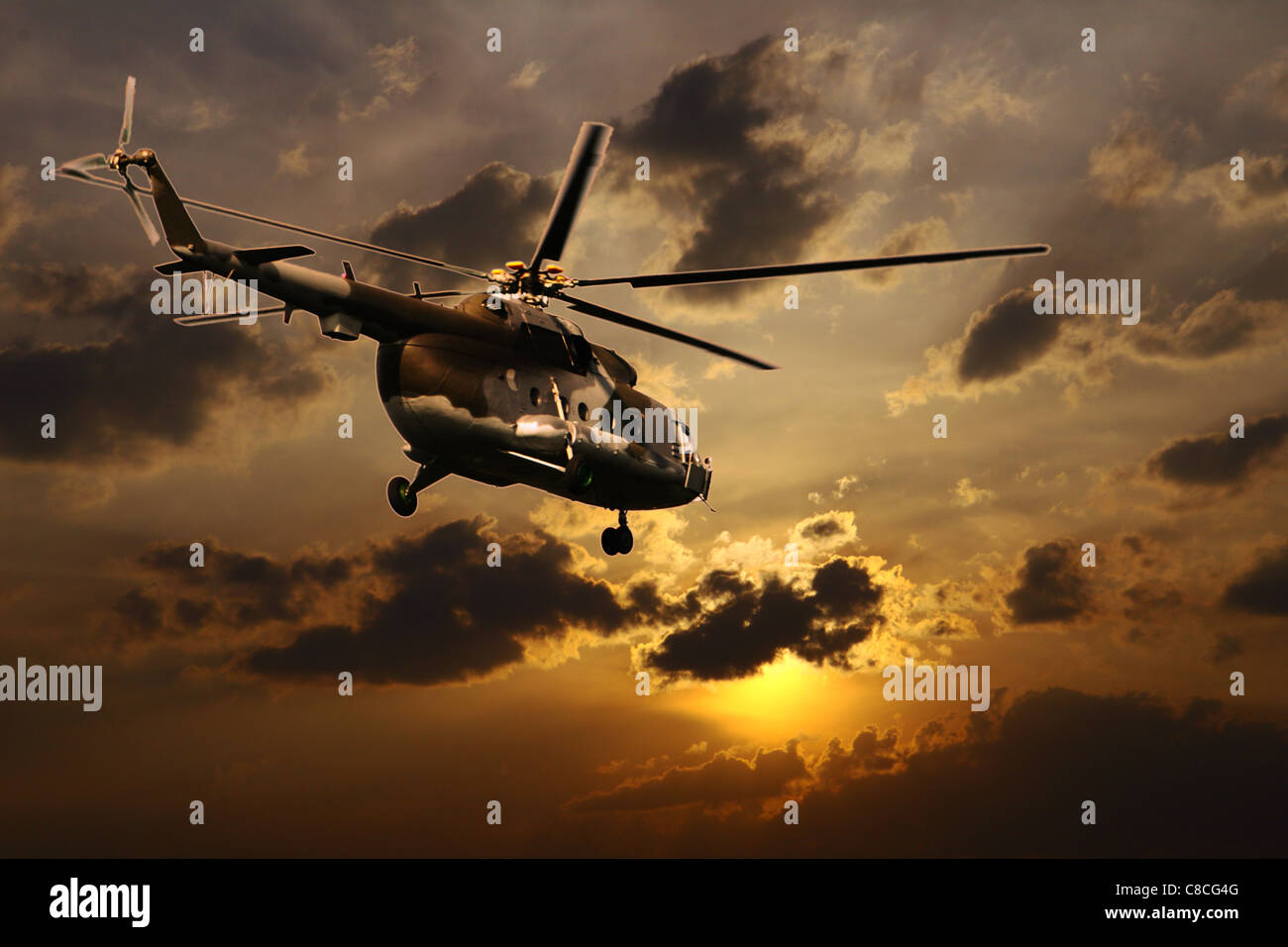Helicopter landing at sunset Stock Photo - Alamy