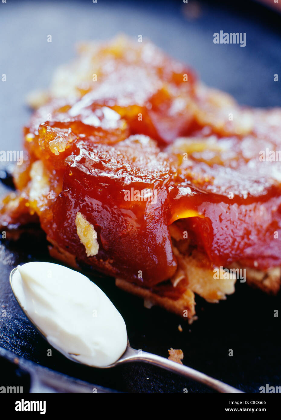 Upside-down apple tart with Calvados cream Stock Photo - Alamy