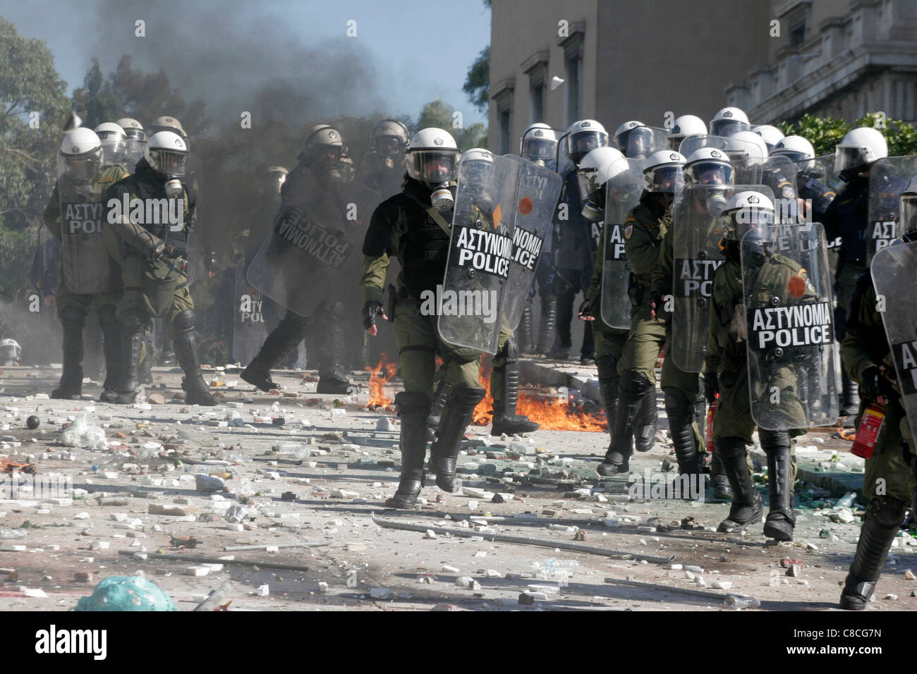 Athens Greece, 19/10/2011. Protesters clash with riot police, throwing ...