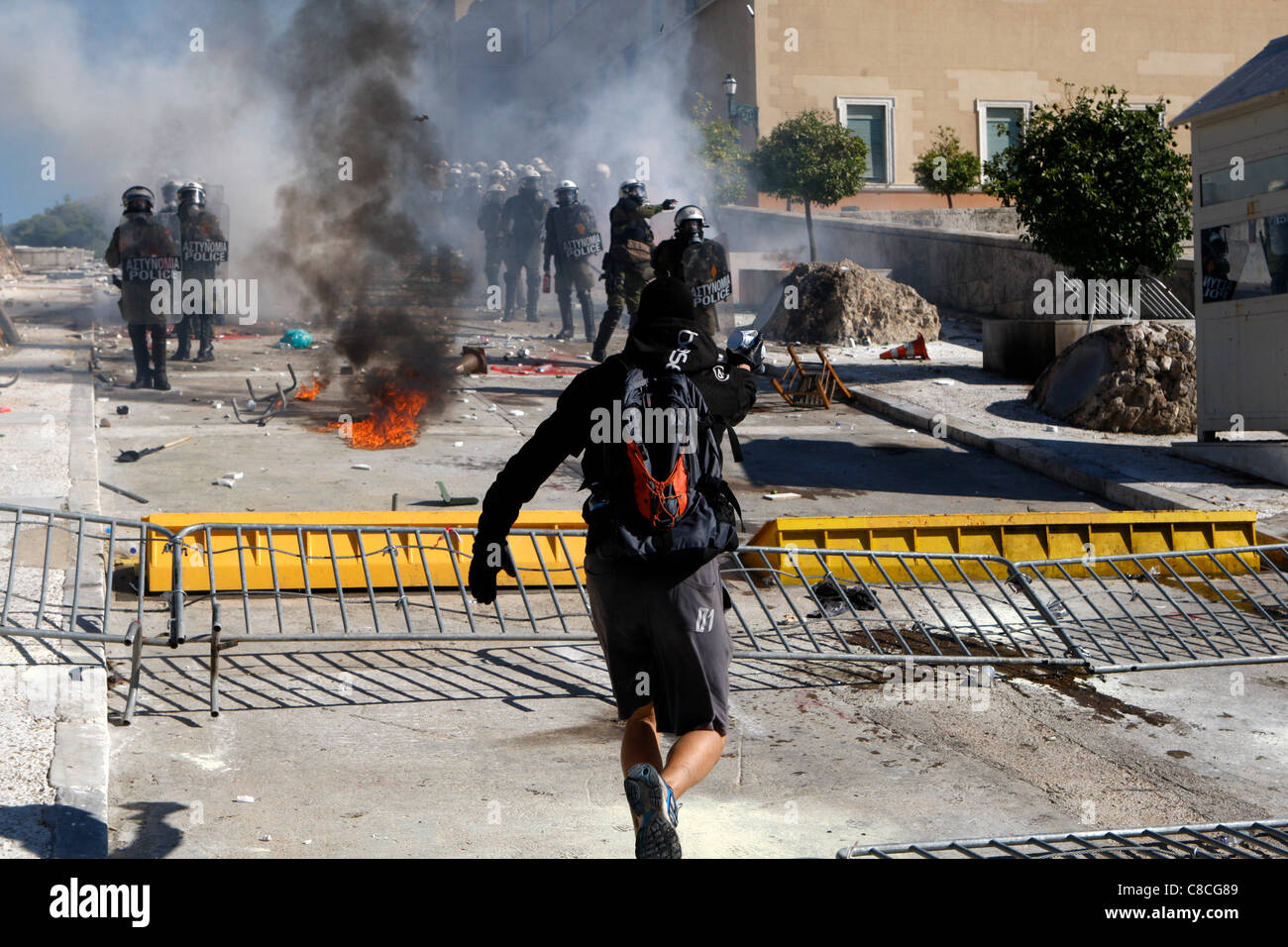 19 October 2011 Athens Greece. Protesters clash with riot police, throw ...