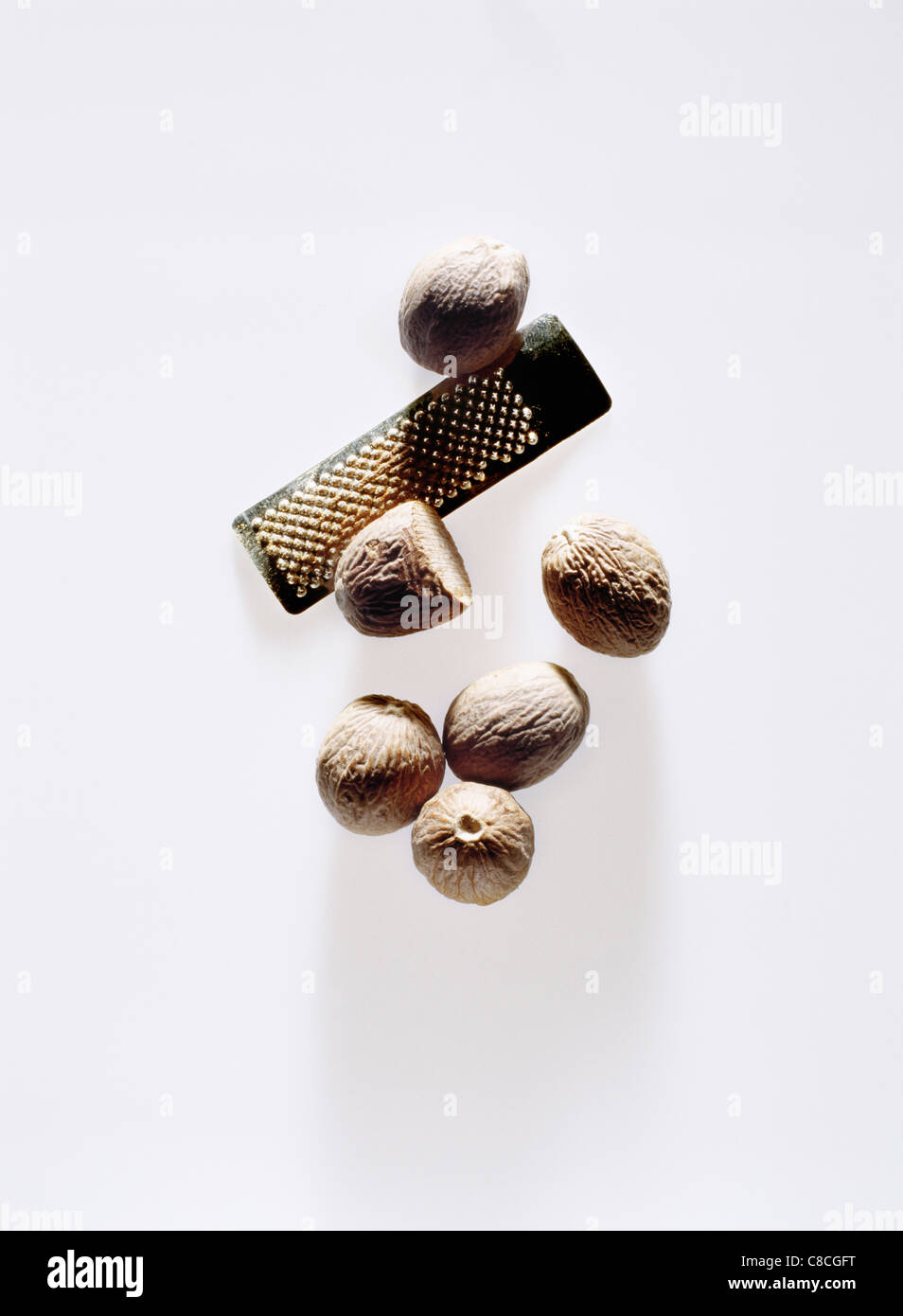 Nutmeg and small grater Stock Photo - Alamy