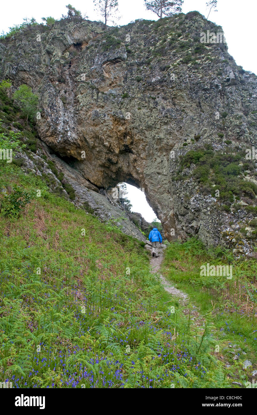 Footpath through a natural rock arch near Port Appin, Argyll Stock ...