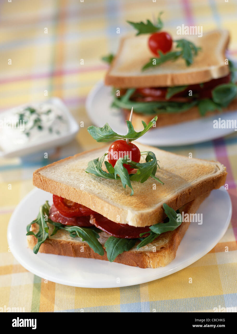 Bacon and rocket toasted sandwich Stock Photo - Alamy