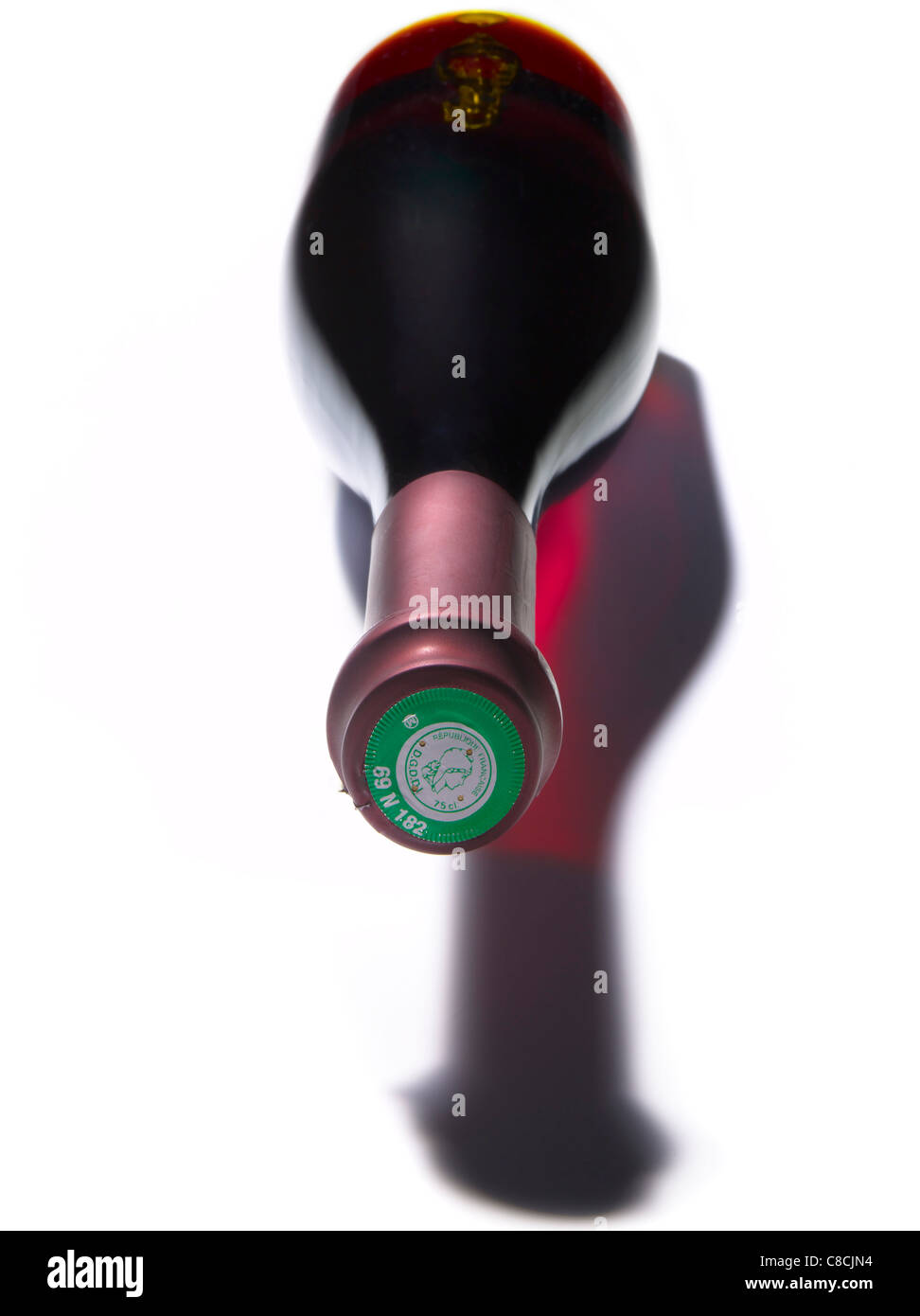Bottle of red wine with shadow Stock Photo - Alamy