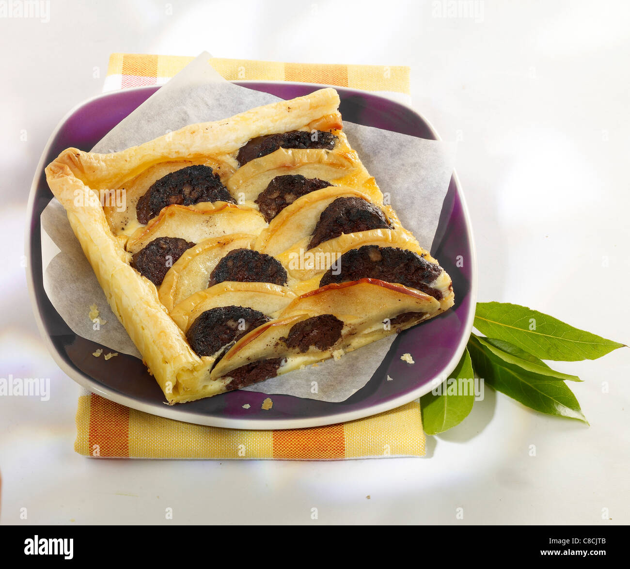 Portion of flaky pastry boudin tart Stock Photo - Alamy