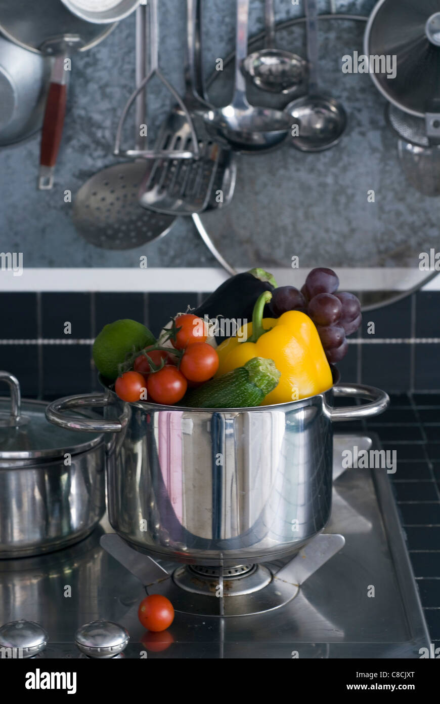 Cooking pot full of raw vegetables Stock Photo - Alamy