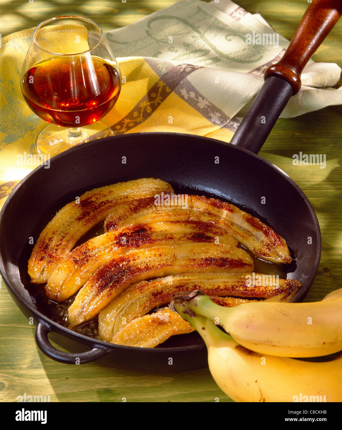 Rum flamed bananas in pan Stock Photo - Alamy