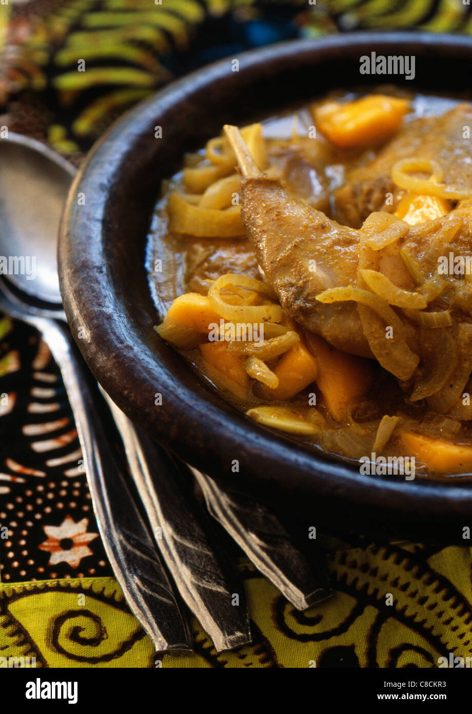Sauteed rabbit with curry and mango Stock Photo - Alamy