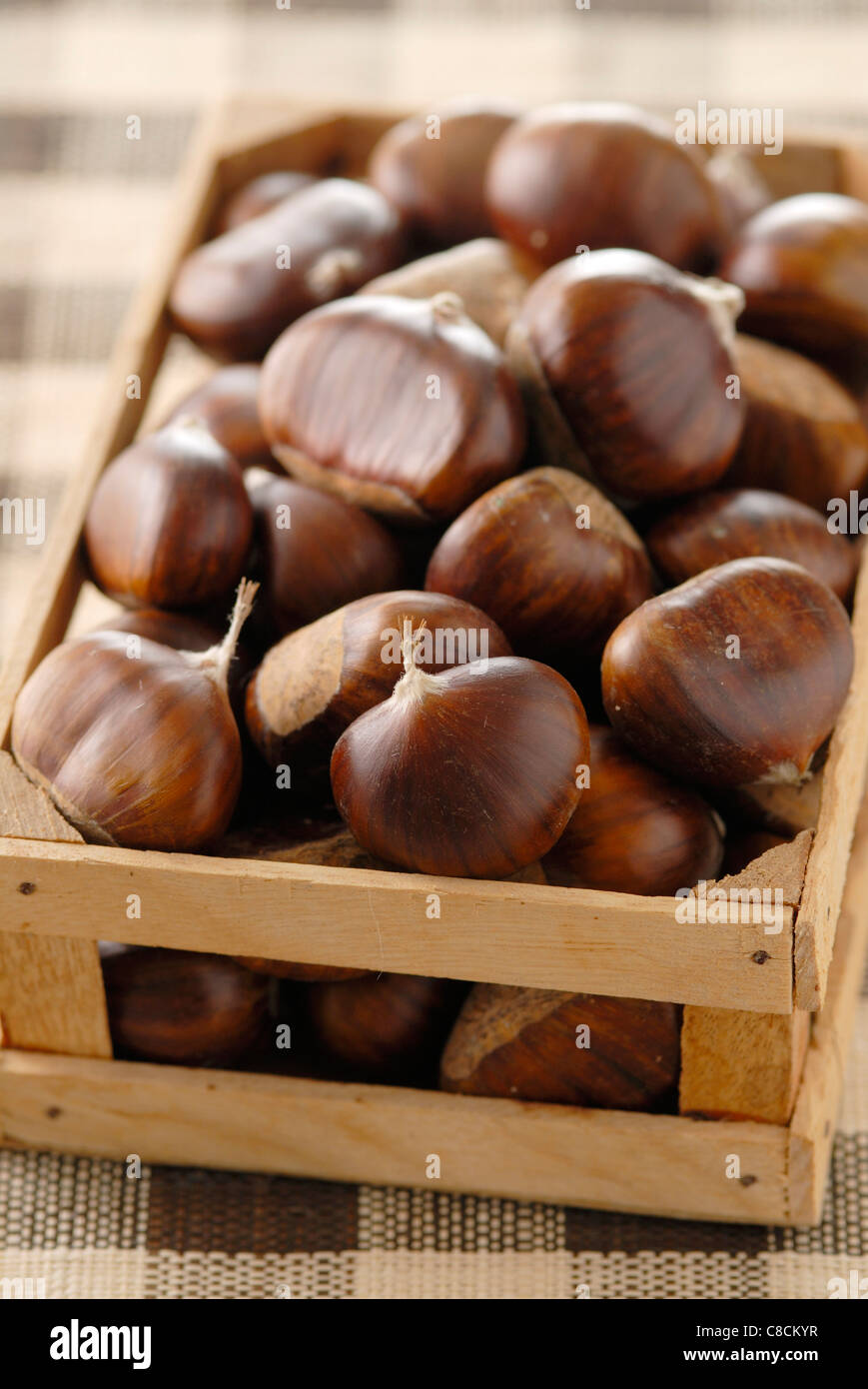 Small crate of chestnuts Stock Photo - Alamy