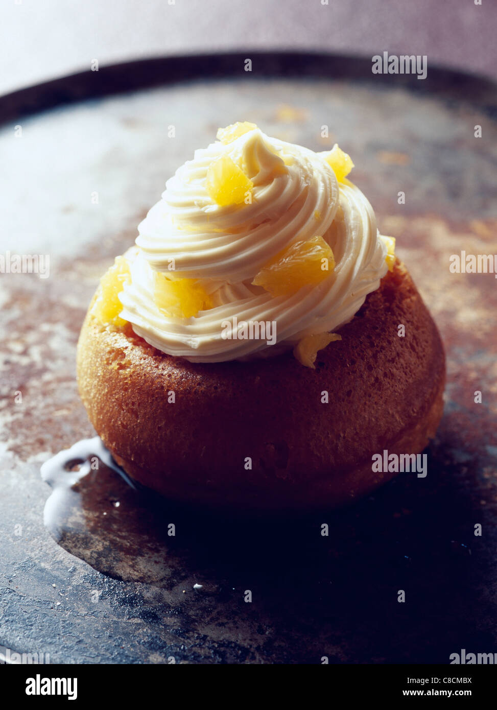 Baba with Armagnac, whipped cream and orange Stock Photo - Alamy