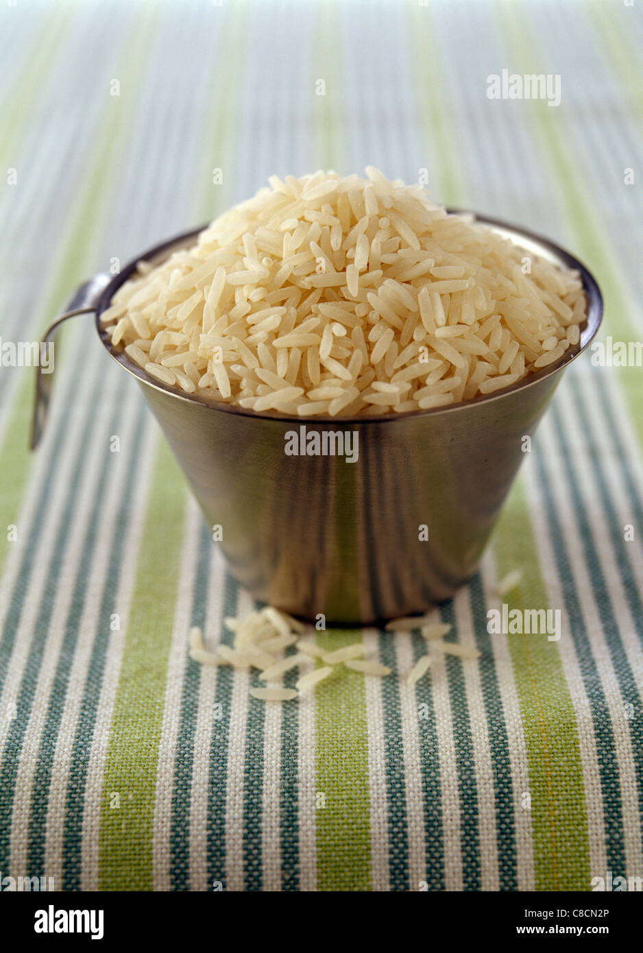 Bowl of uncooked white rice Stock Photo - Alamy
