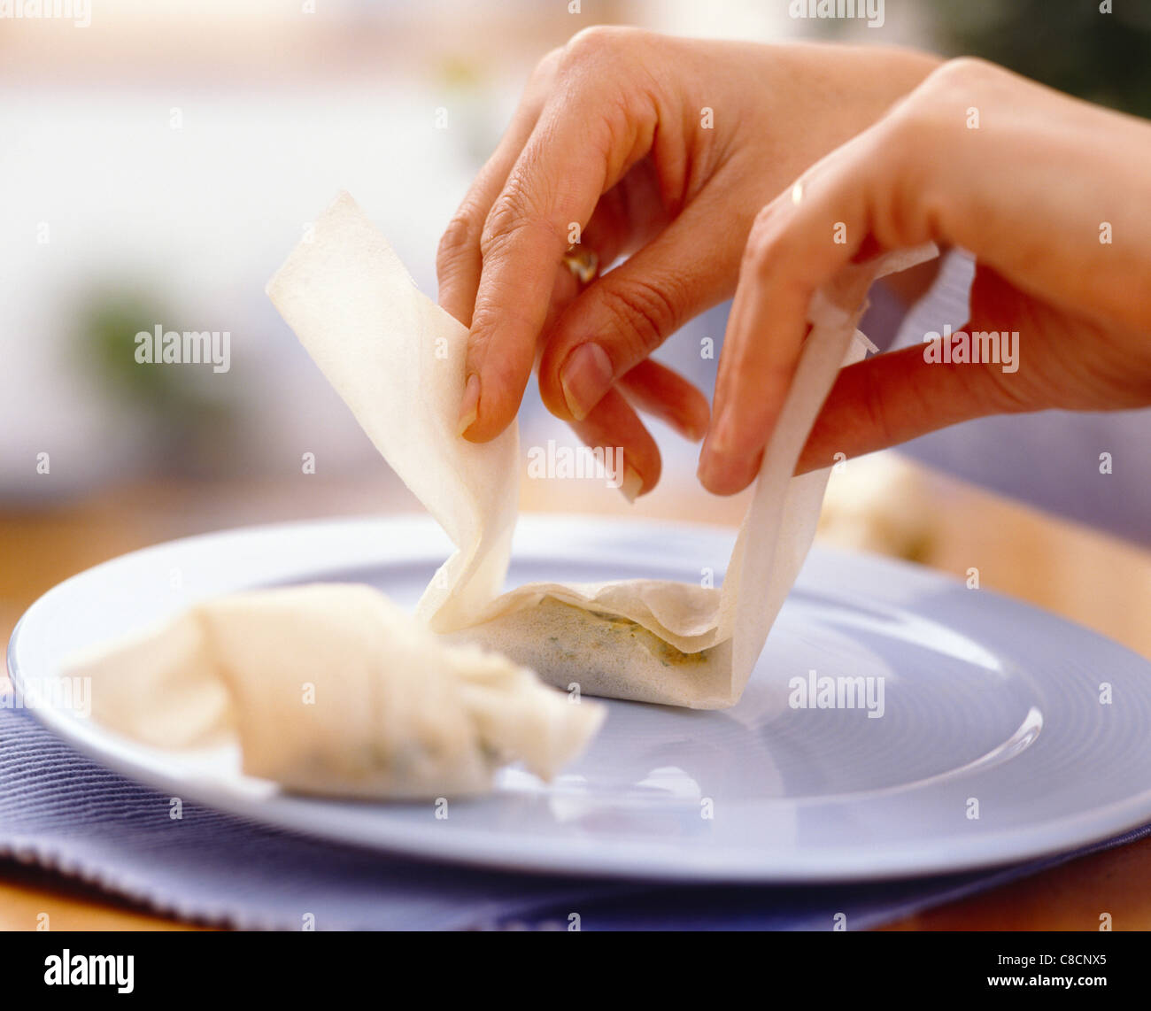 Folding the stuffed filo pastry Stock Photo - Alamy
