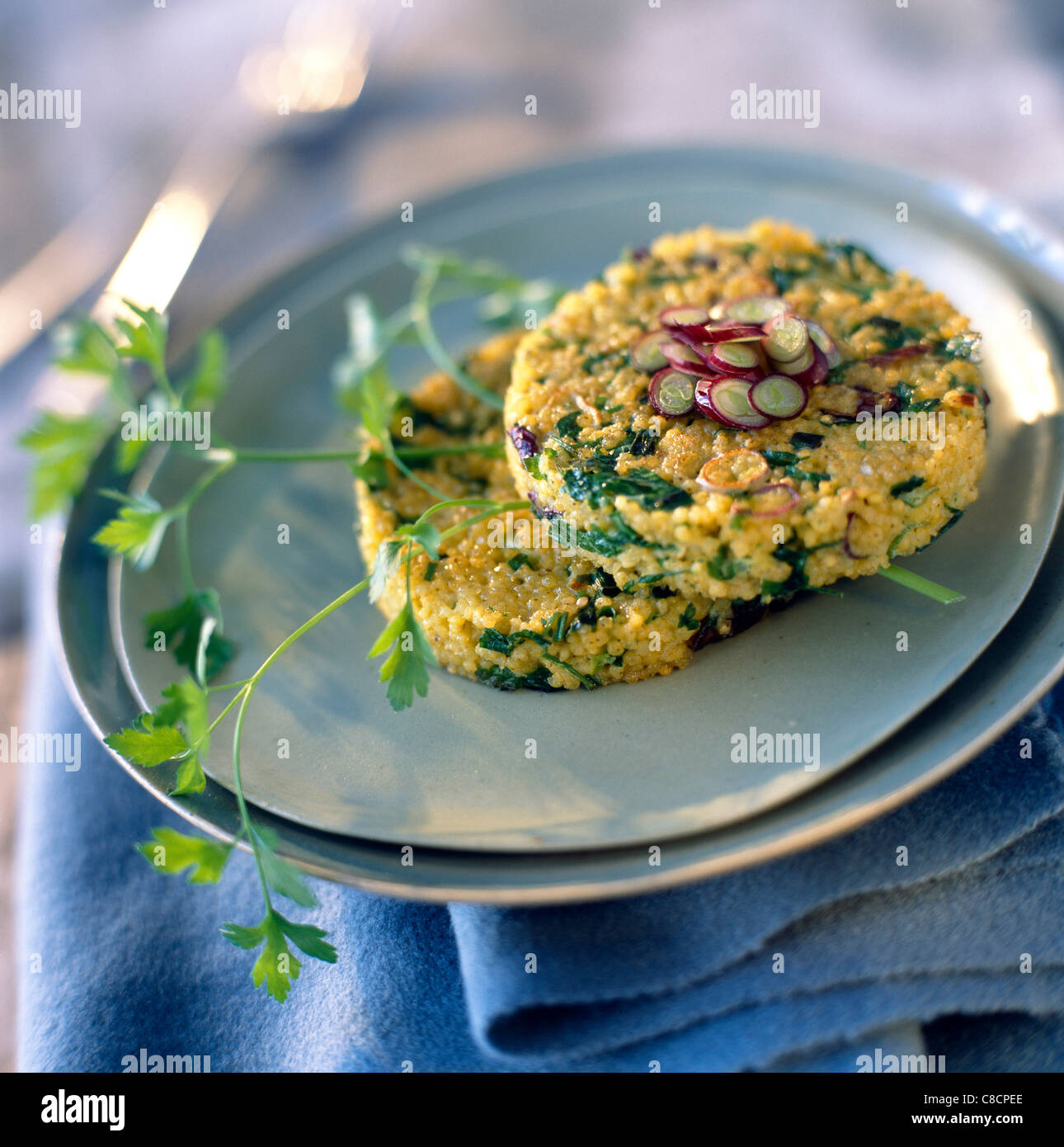 Millet, shallot and herb cakes Stock Photo - Alamy