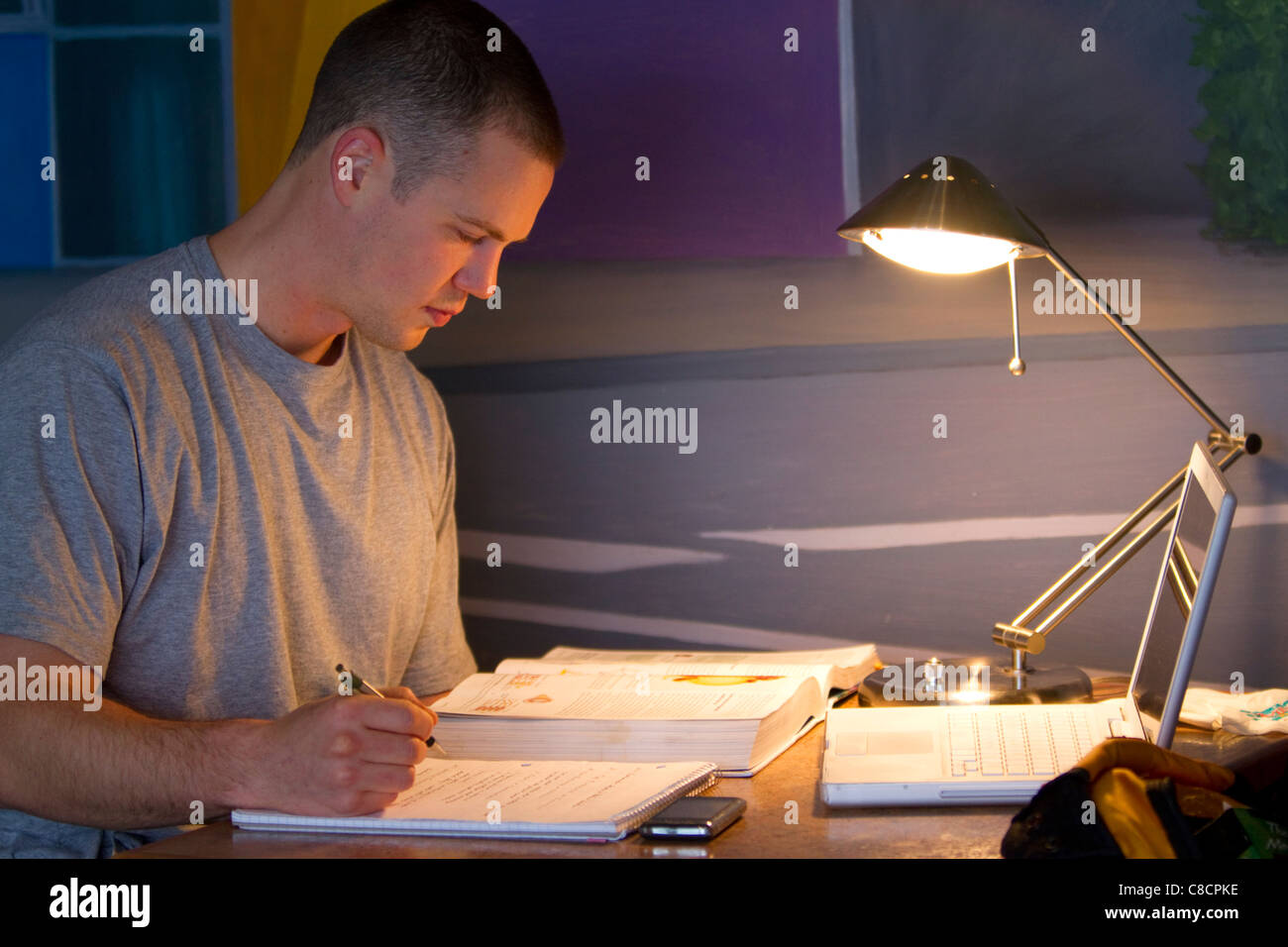 Male student studying a textbook in Boise, Idaho, USA Stock Photo - Alamy