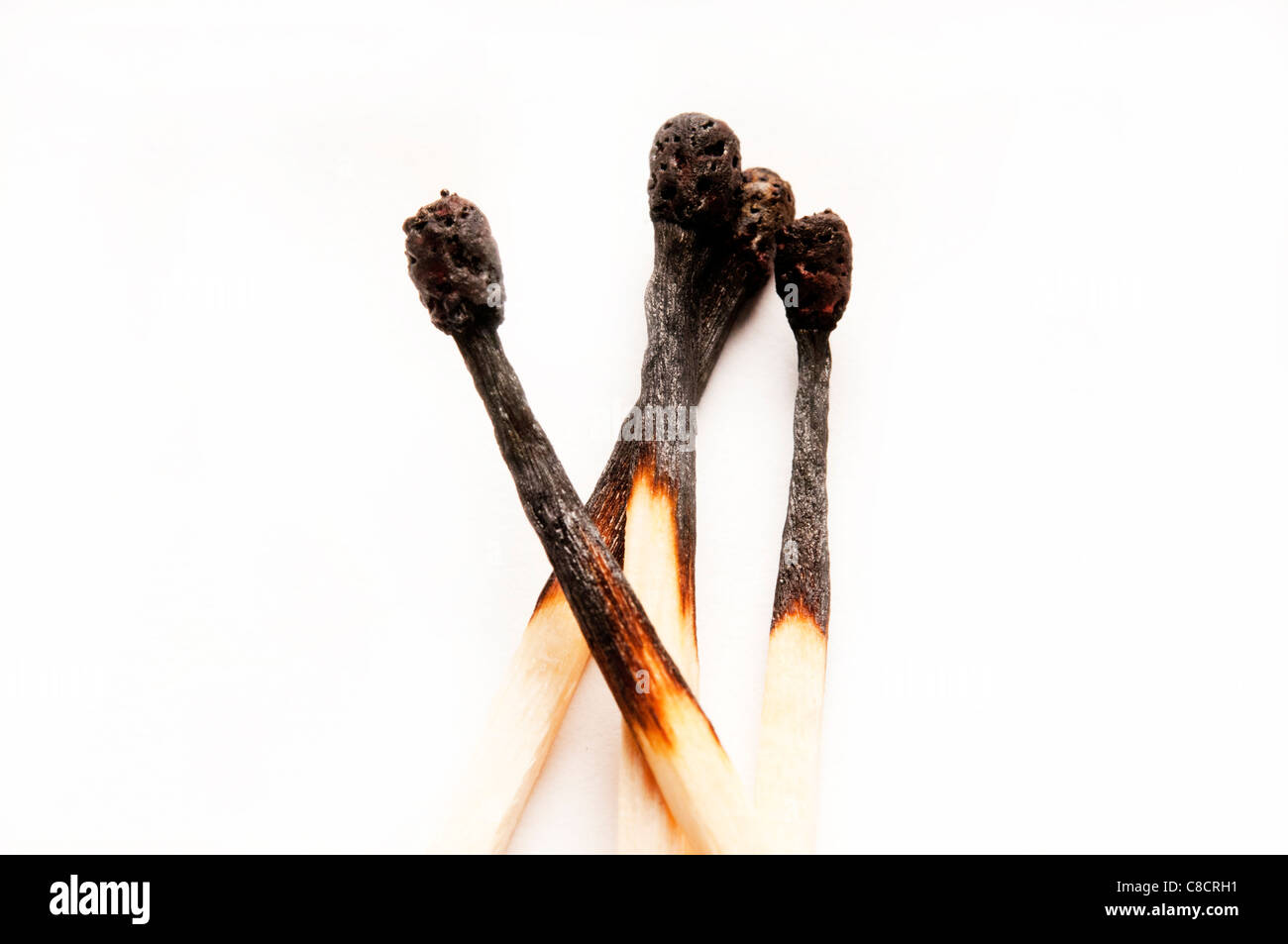 four burnt matches Stock Photo - Alamy