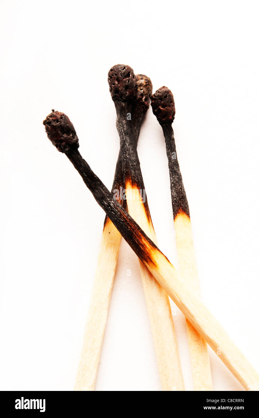 four burnt matches Stock Photo - Alamy