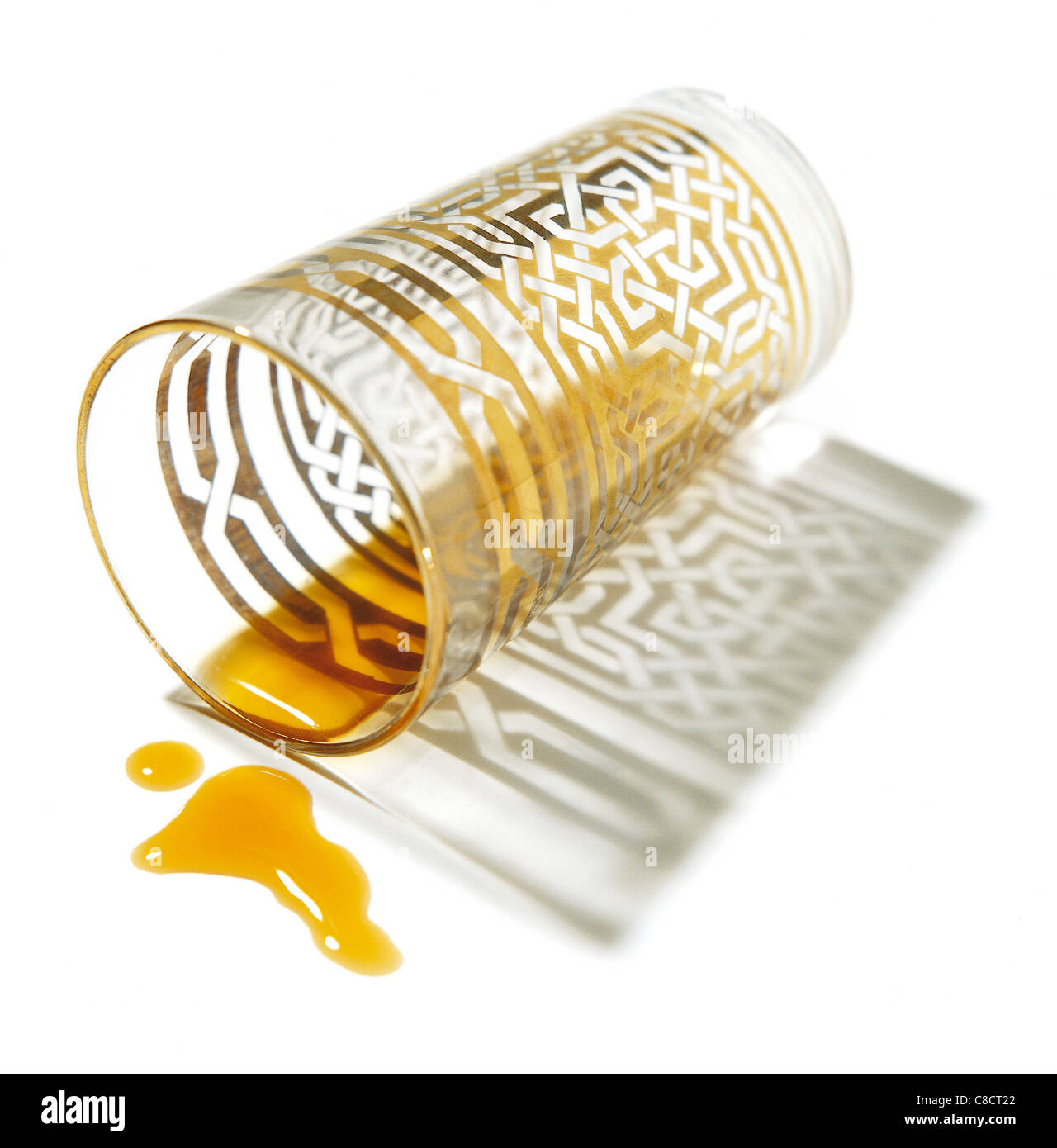 Overturned glass with dregs of tea Stock Photo - Alamy