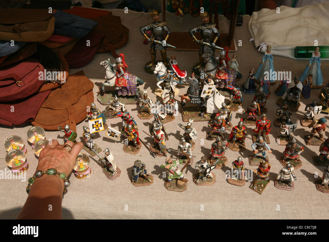 Vendor sells toy solders at the medieval market during the re-enactment ...