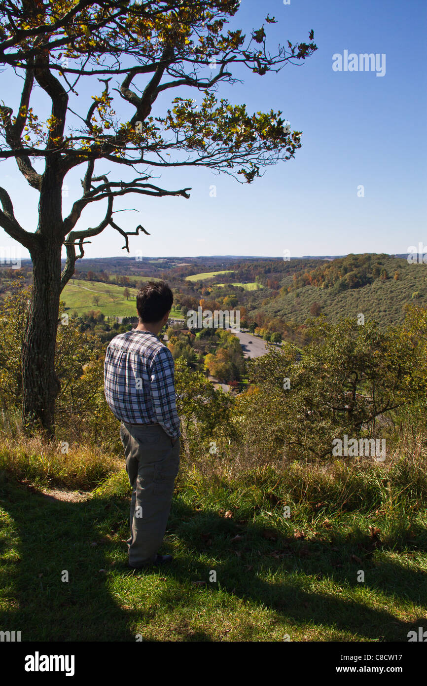 Man looking out over an scenic overlook Stock Photo - Alamy