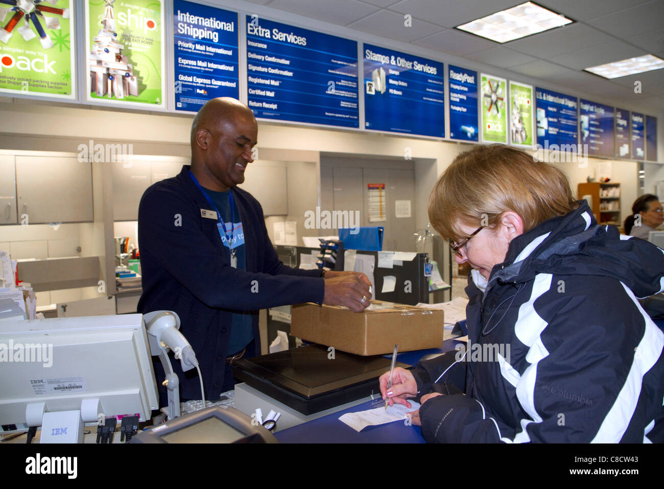 Female postal worker hi-res stock photography and images - Alamy