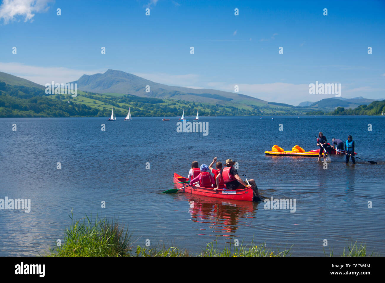 Father and three children canoeing on Bala Lake Llyn Tegid Gwynedd ...