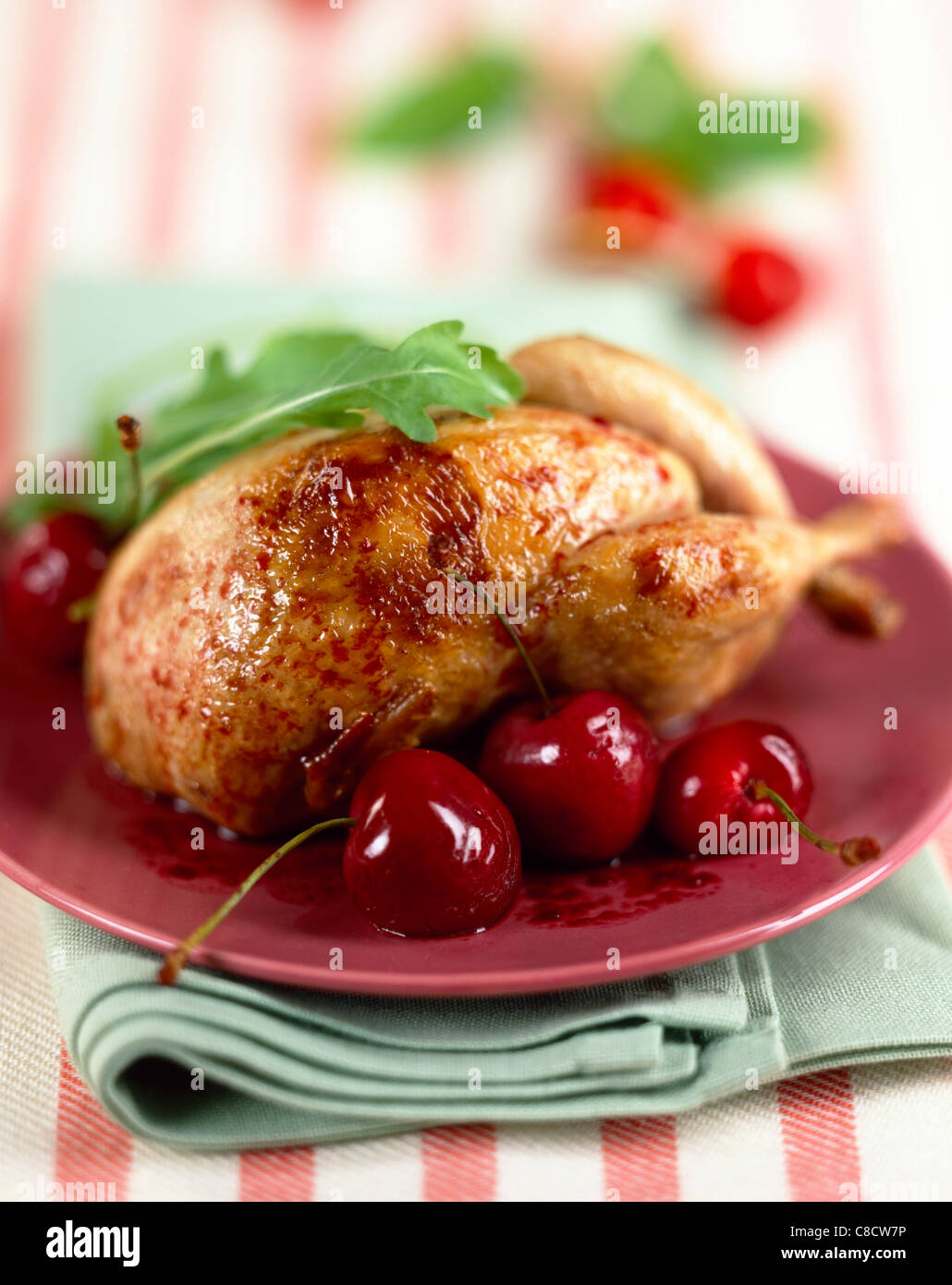 Free-range quail with fresh cherries Stock Photo - Alamy