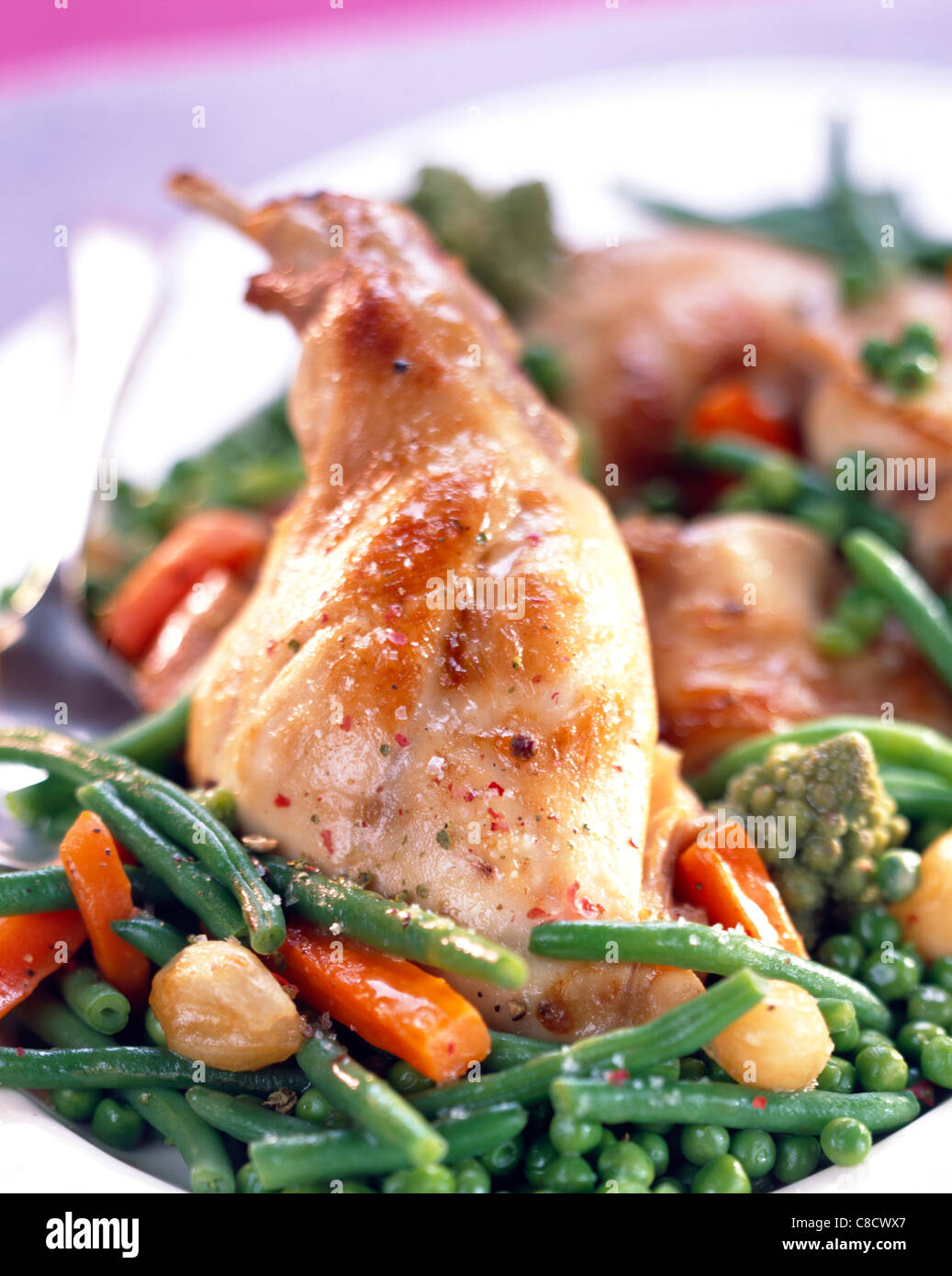 Roast rabbit with young vegetables Stock Photo - Alamy