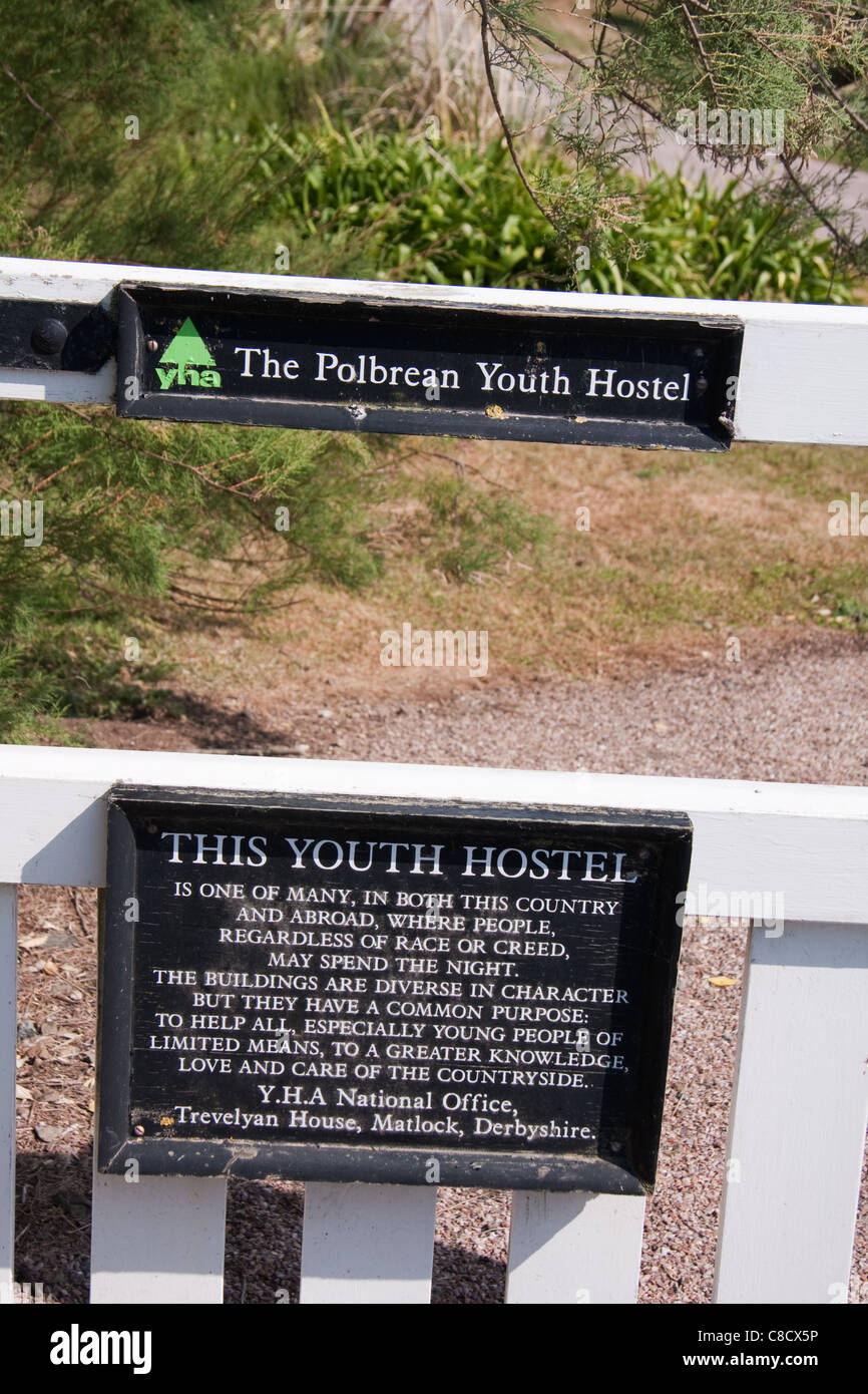 Signs on entrance gate to Polbrean Youth Hostel Stock Photo - Alamy