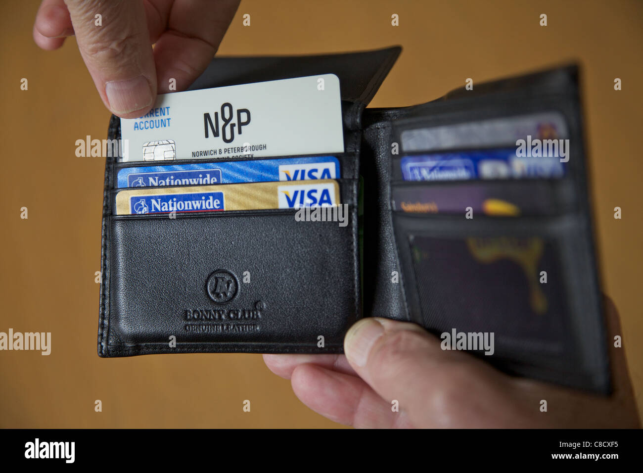A wallet with debit and credit cards, England Stock Photo - Alamy