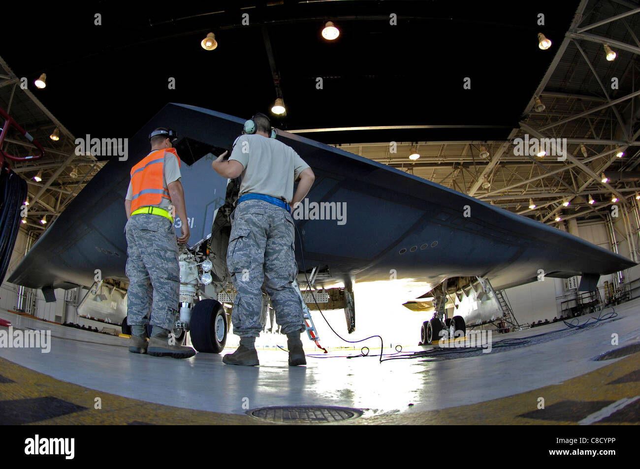 A B-2 Spirit waits as crew chiefs with the 509th Aircraft Maintenance ...