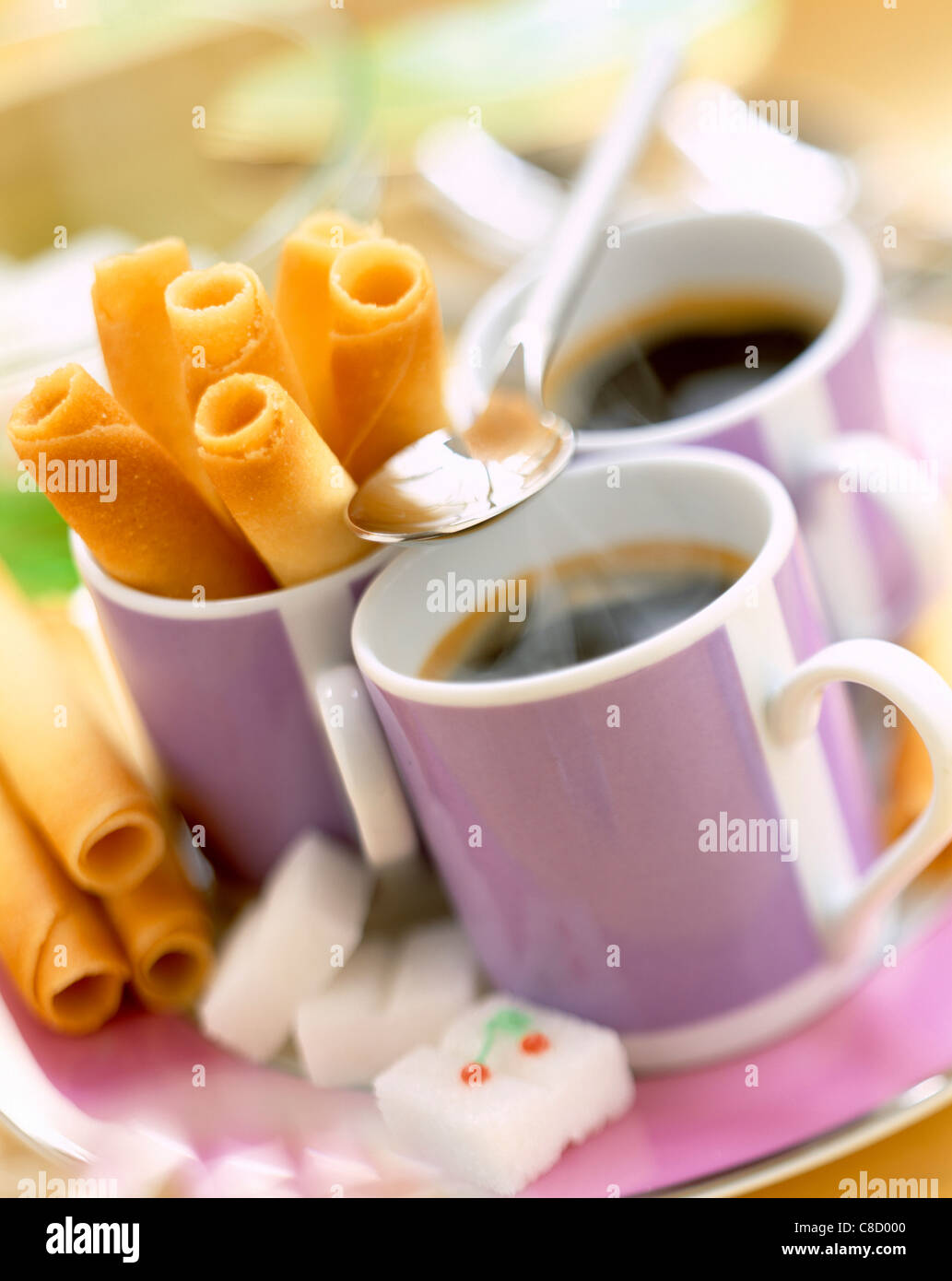 steaming coffee with wafer cigar biscuits Stock Photo - Alamy