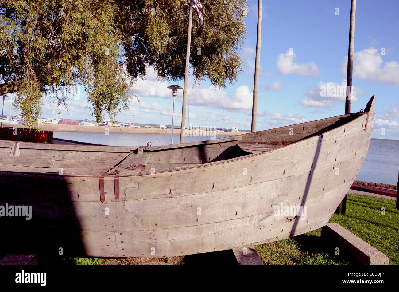 Antique wooden boat in exhibition on the lake shore Stock Photo - Alamy