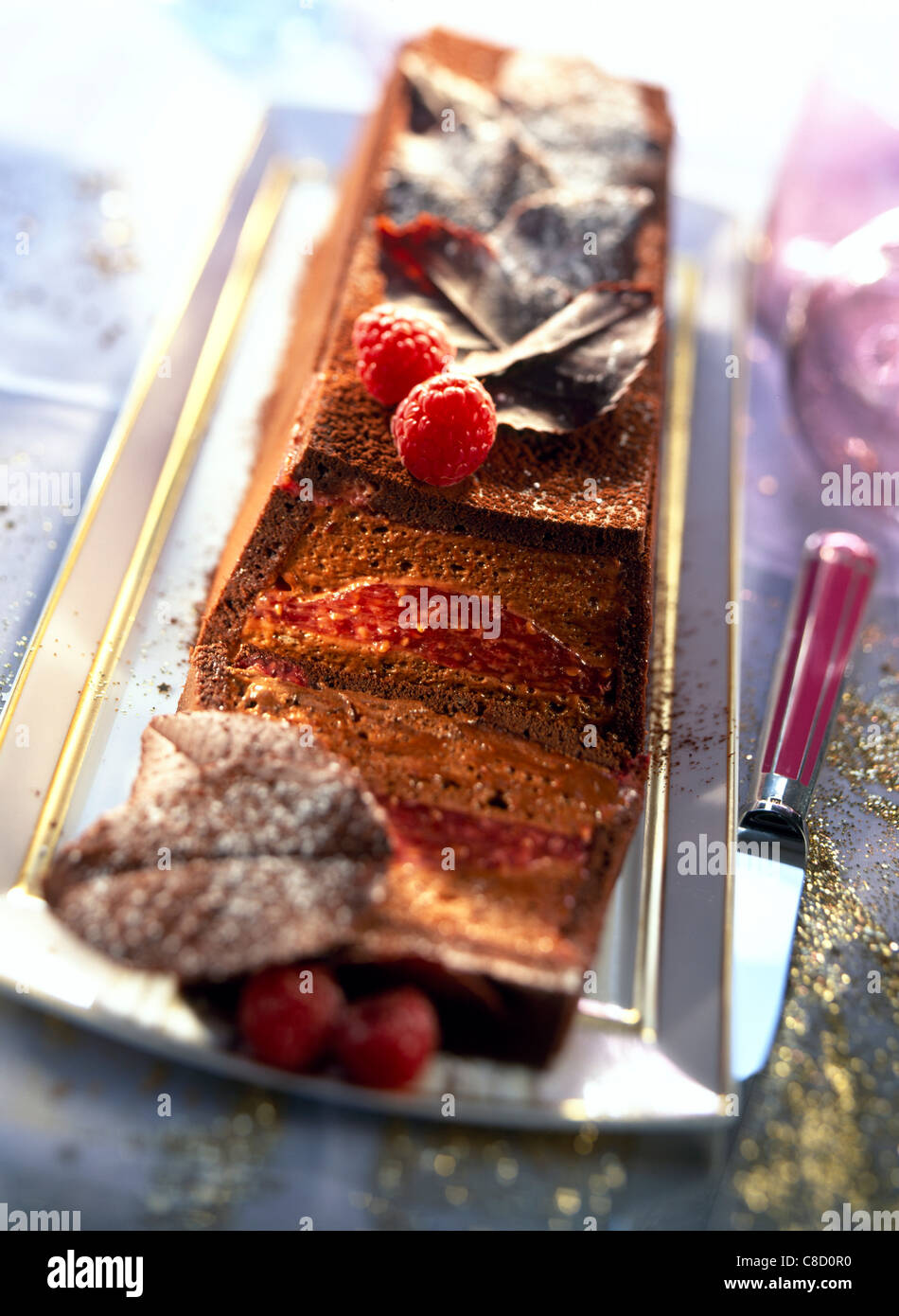 Chocolate and raspberry log cake Stock Photo - Alamy