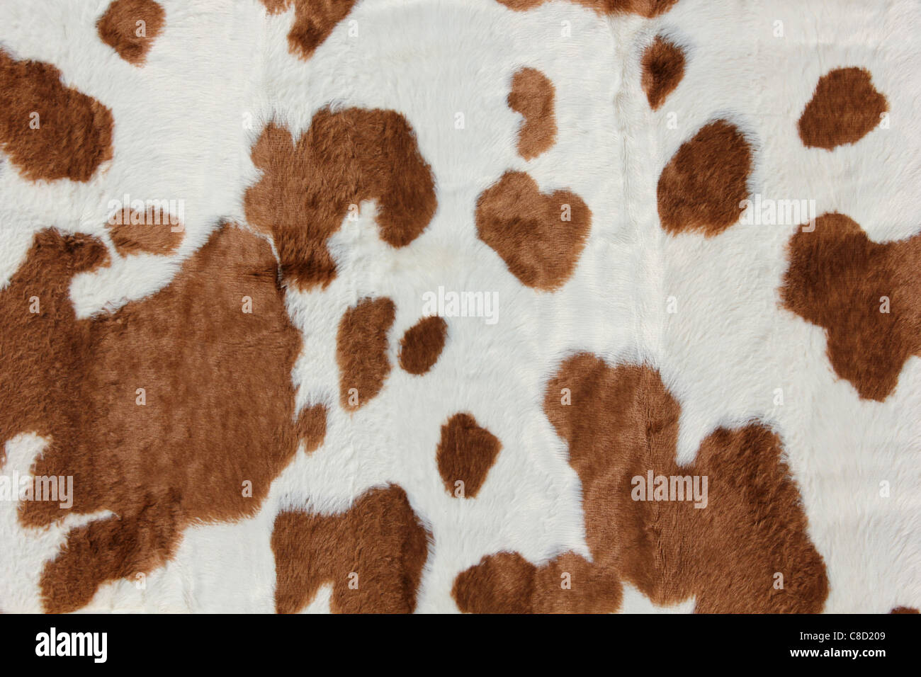 Brown and white cow skin Stock Photo - Alamy