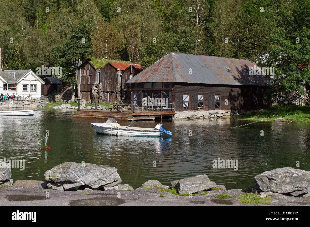 Small boat in the water in Norway village Stock Photo - Alamy