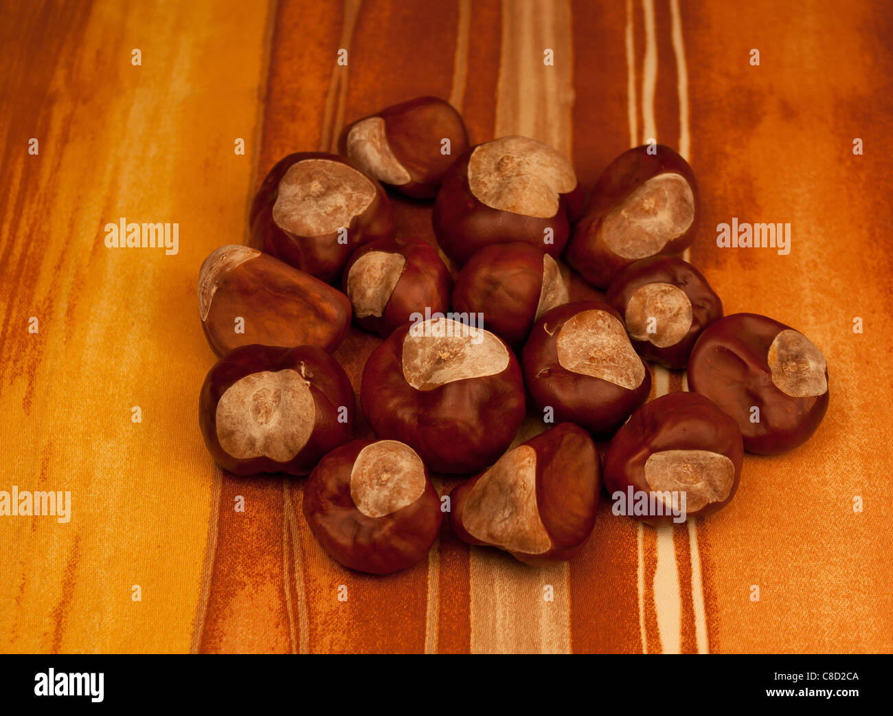 Chestnuts on a table-cover Stock Photo - Alamy