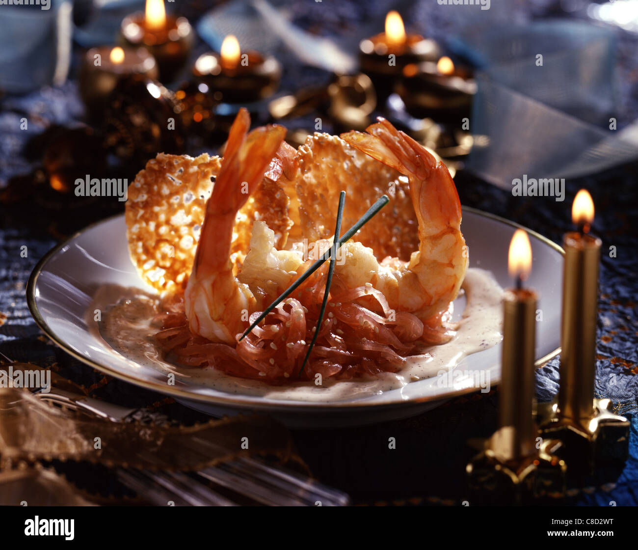 Mediterranean prawns with stewed onions and sesame seed wafers Stock ...