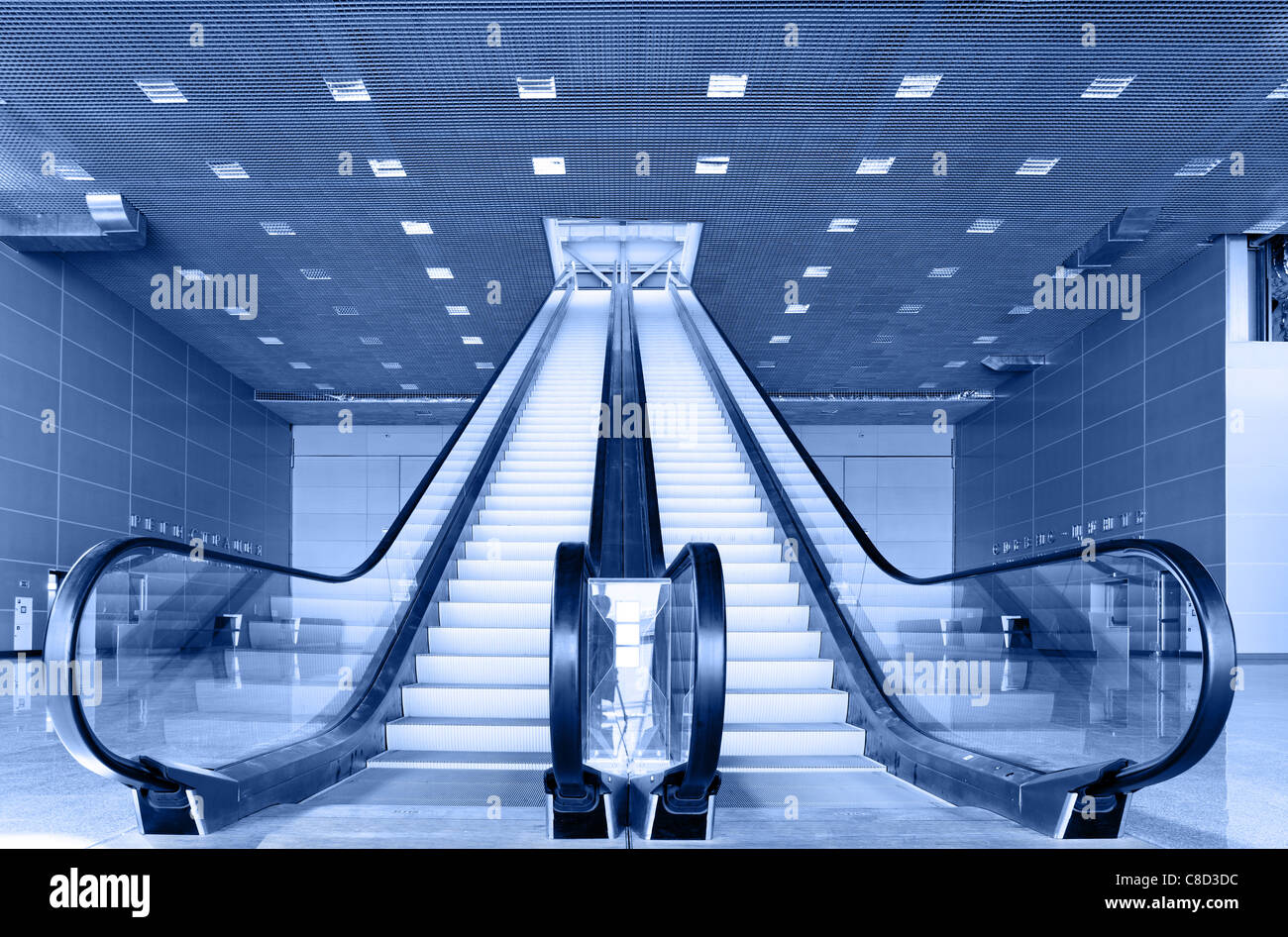 Perspective of escalator toned in blue color Stock Photo - Alamy