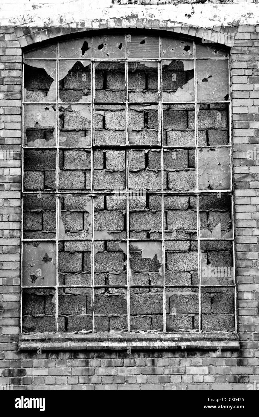 A smashed up window of a derelict warehouse in Loughborough Stock Photo ...