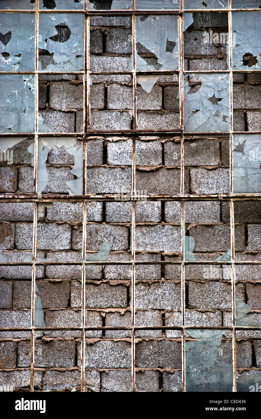 A smashed up window of a derelict warehouse in Loughborough Stock Photo ...