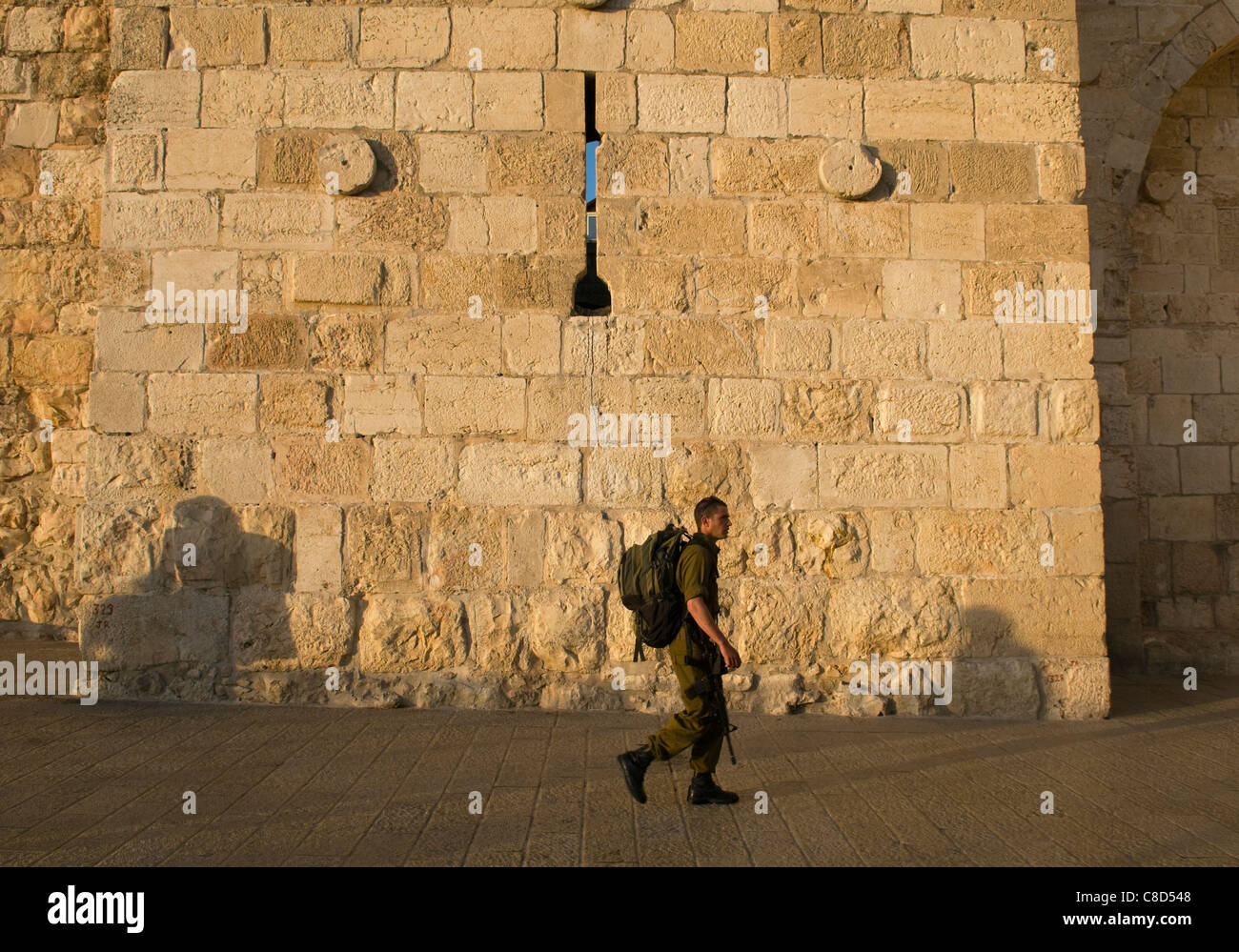 Israeli soldier walks into the Jaffa Gate of the old city of Jerusalem ...