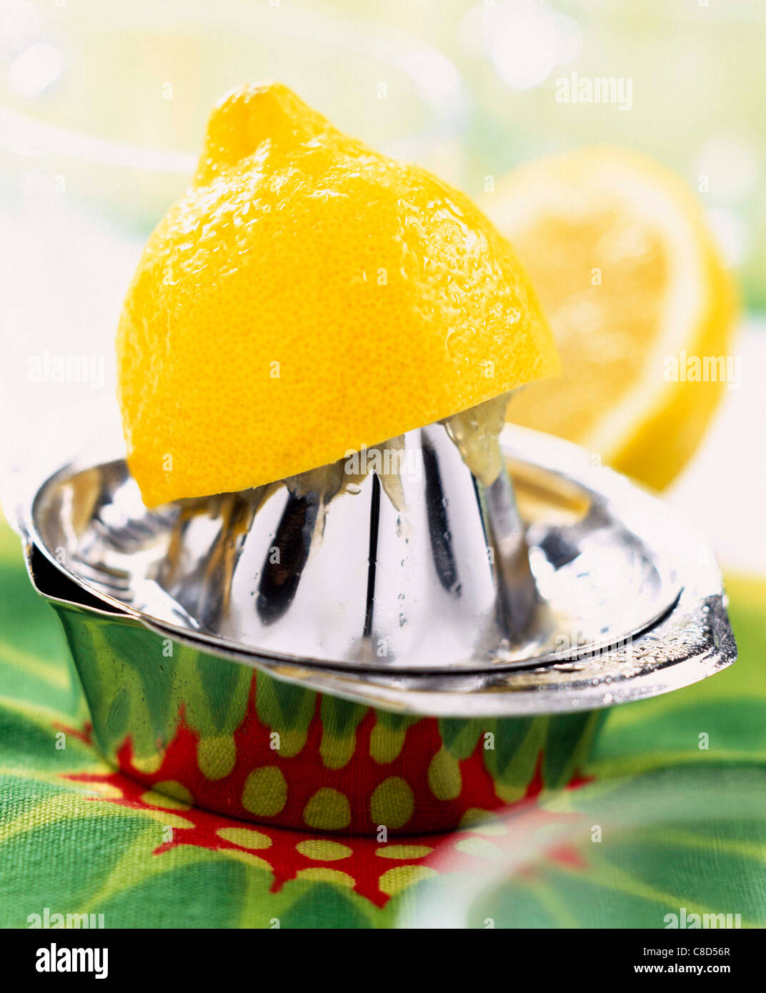 Lemon and squeezer Stock Photo - Alamy