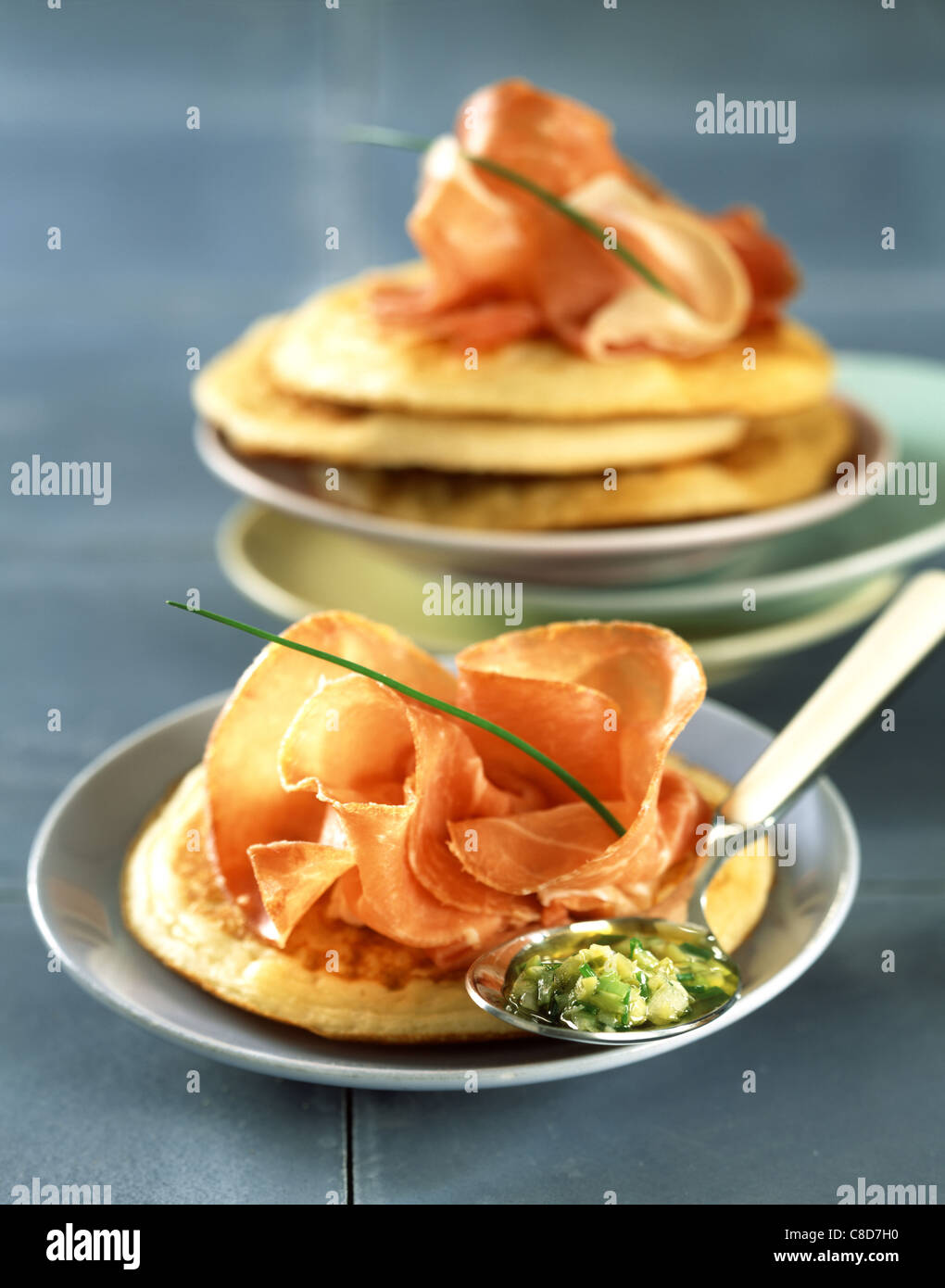 Blinis with ham rosettes Stock Photo - Alamy