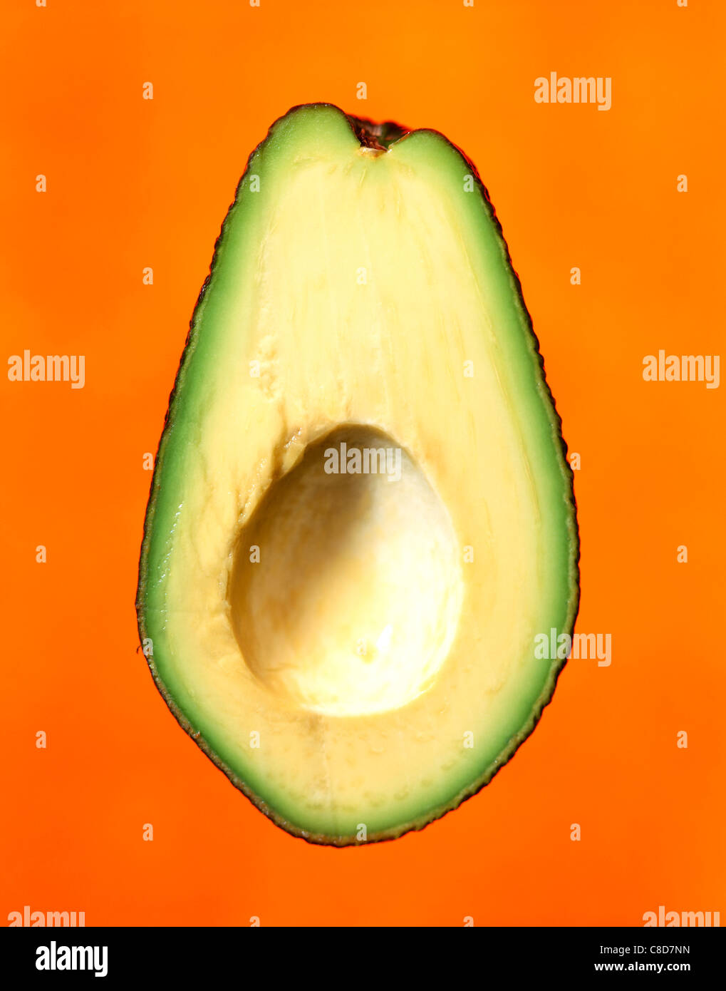 Avocado half without stone Stock Photo - Alamy