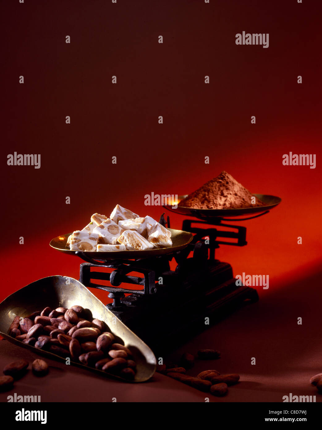 Nougat and cocoa powder on scales with cocoa beans Stock Photo - Alamy