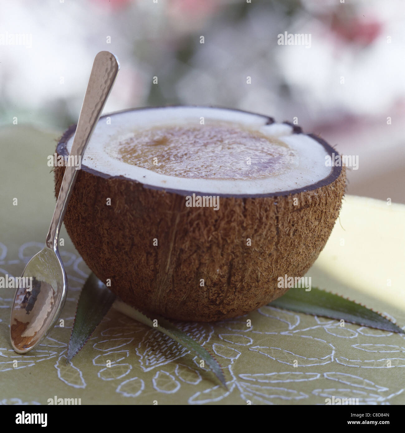 Coconut half and spoon Stock Photo - Alamy