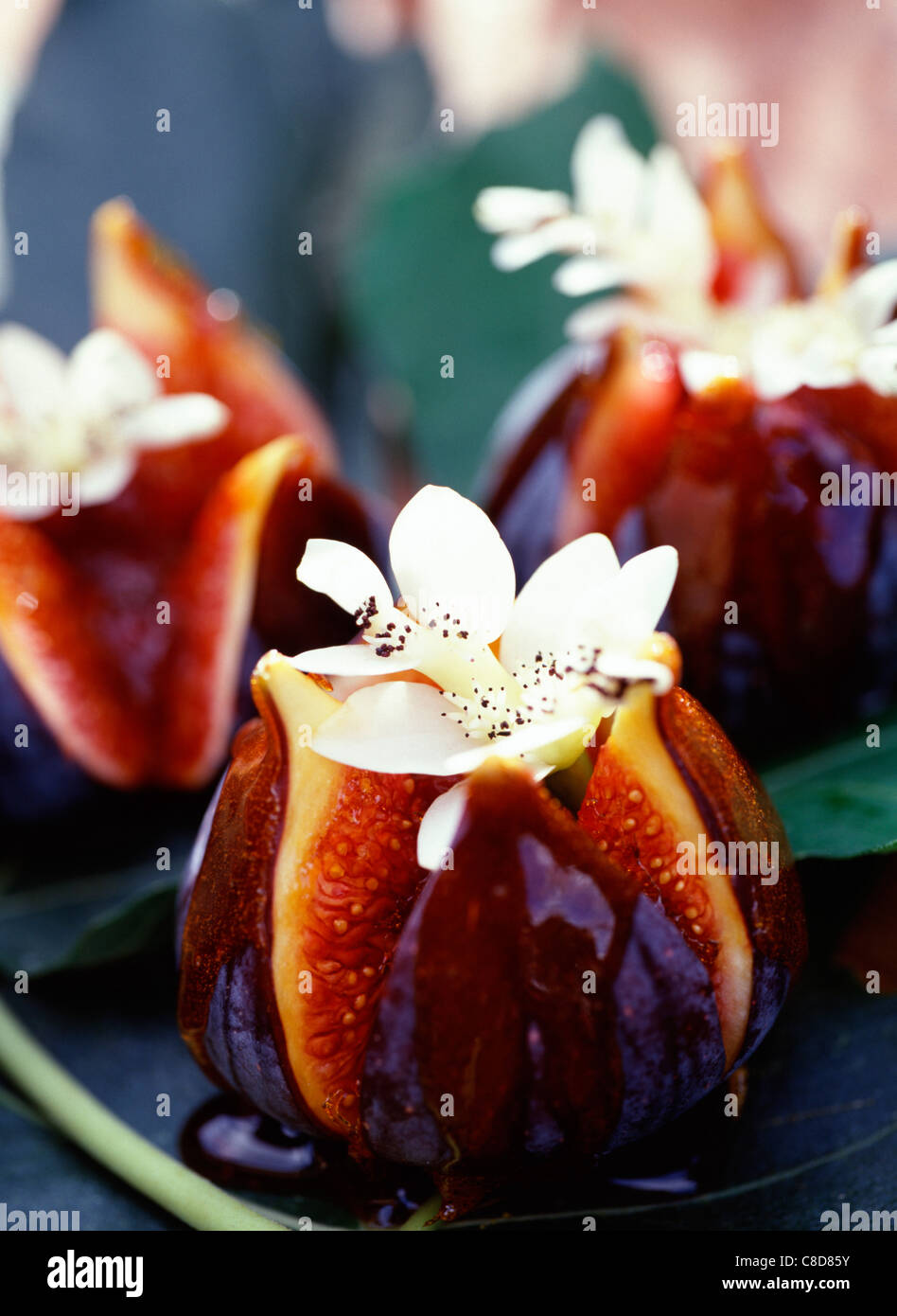 Roast figs with flower decoration Stock Photo - Alamy