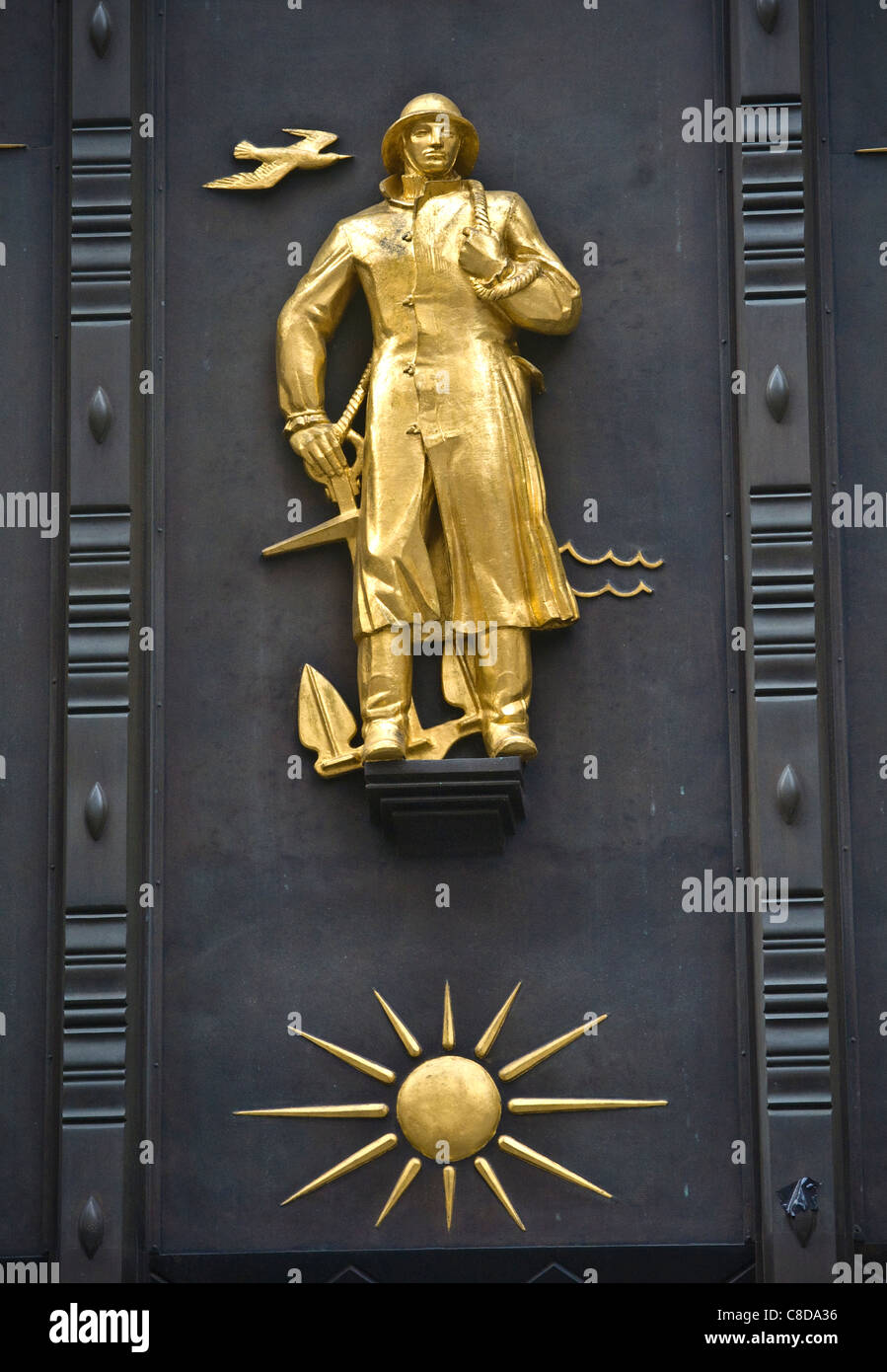 Gilded allegorical figures on large bronze panel representing ...